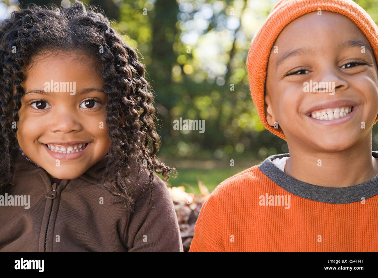 Sister and brother smiling Stock Photo - Alamy