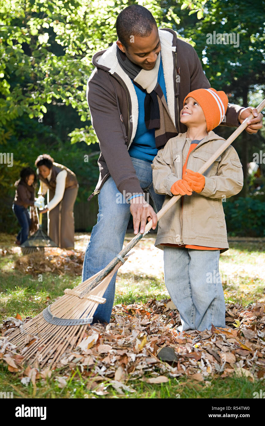 Child sweeping leaves hi-res stock photography and images - Alamy