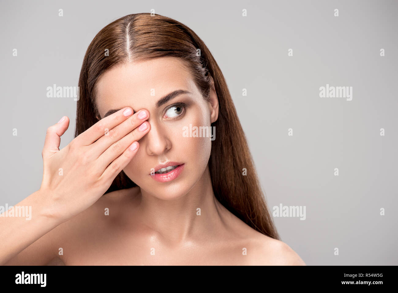 Closing one eye hi-res stock photography and images - Alamy