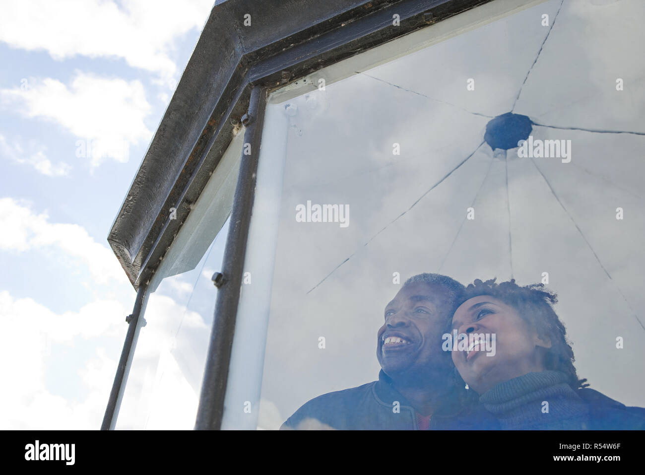 Man peeking out of a window hi-res stock photography and images - Alamy