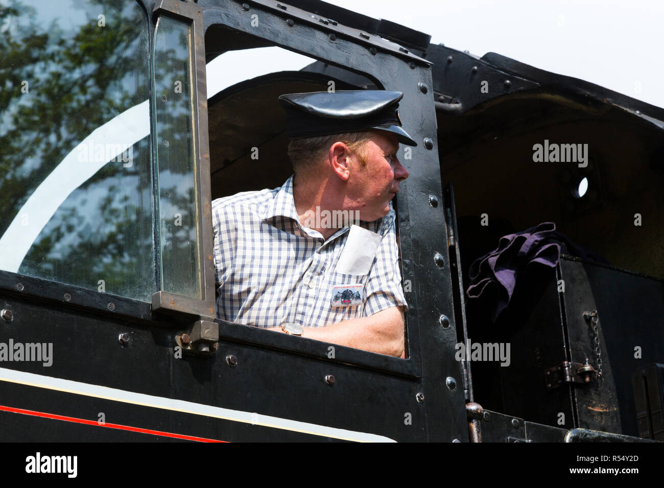 Steam engine number 46447 and locomotive train driver running / working ...