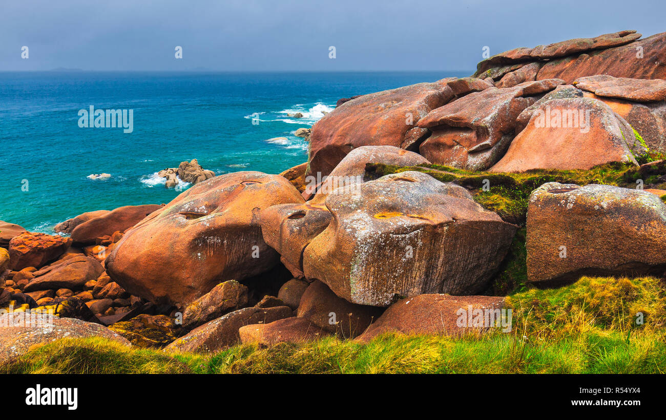 The pink granite rocks with strange shapes, coast in Brittany. The mass ...