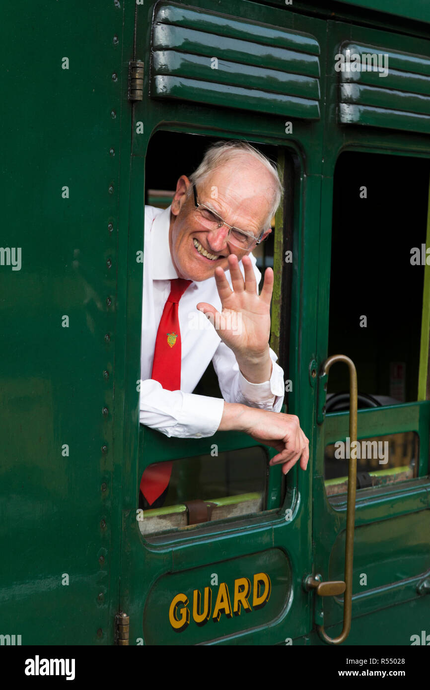 Man waving goodbye from steam train hi-res stock photography and images ...