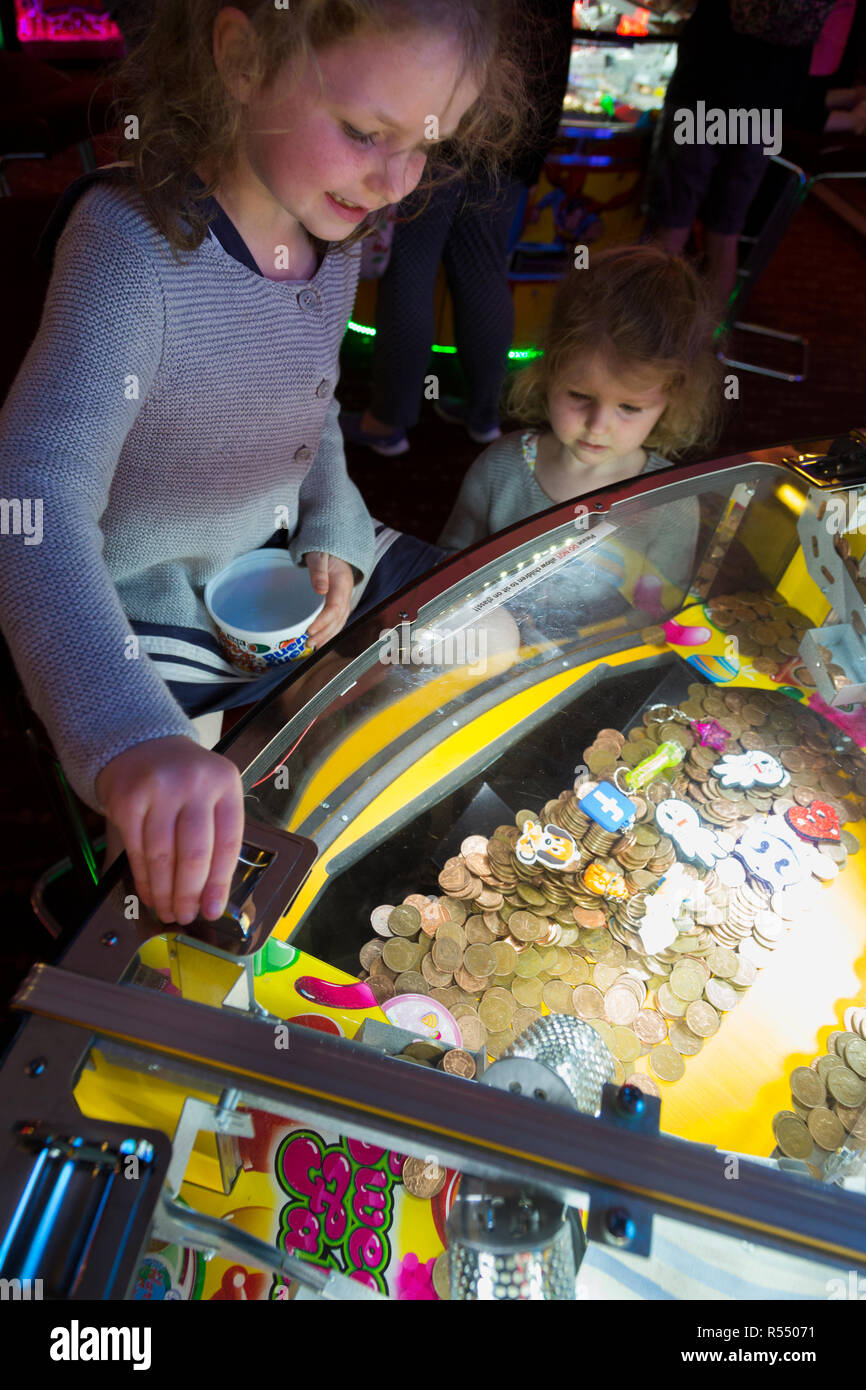 Young girl aged six years old / age 6 years playing on a popular ...