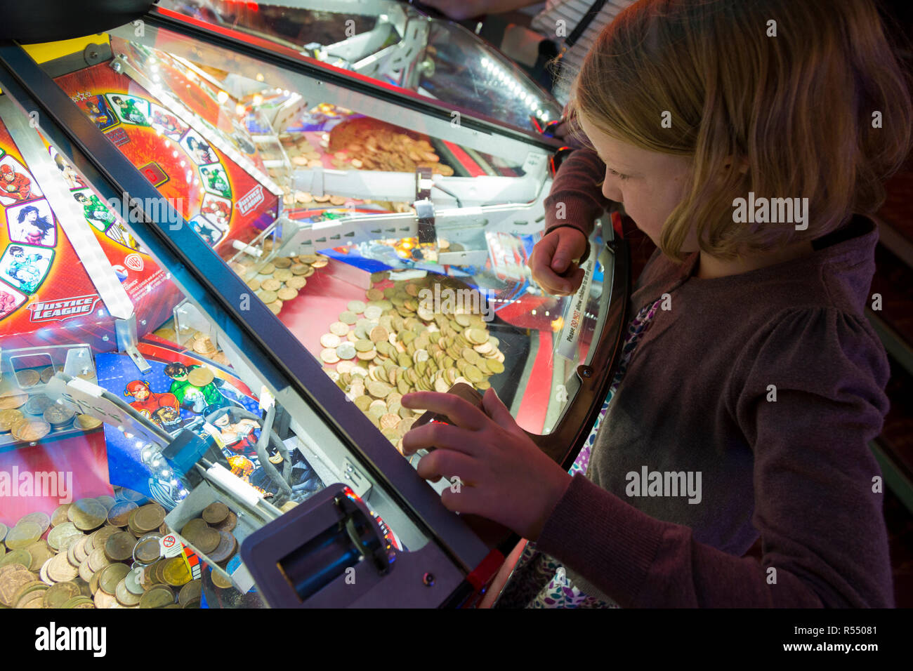 Young girl aged eight years old / age 8 years playing on a popular ...