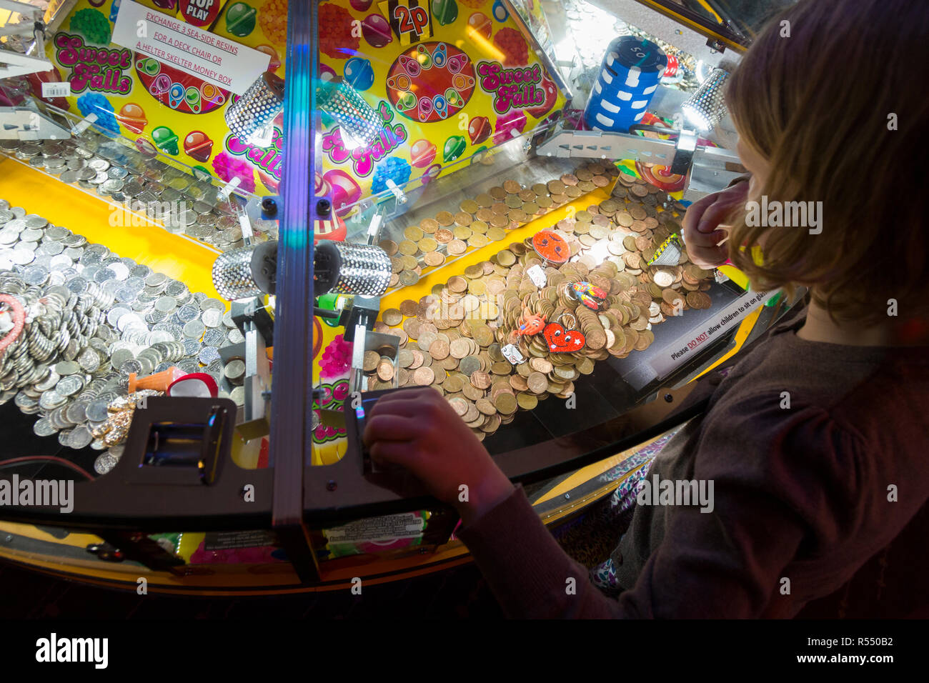 Young girl aged eight years old / age 8 years playing on a popular ...