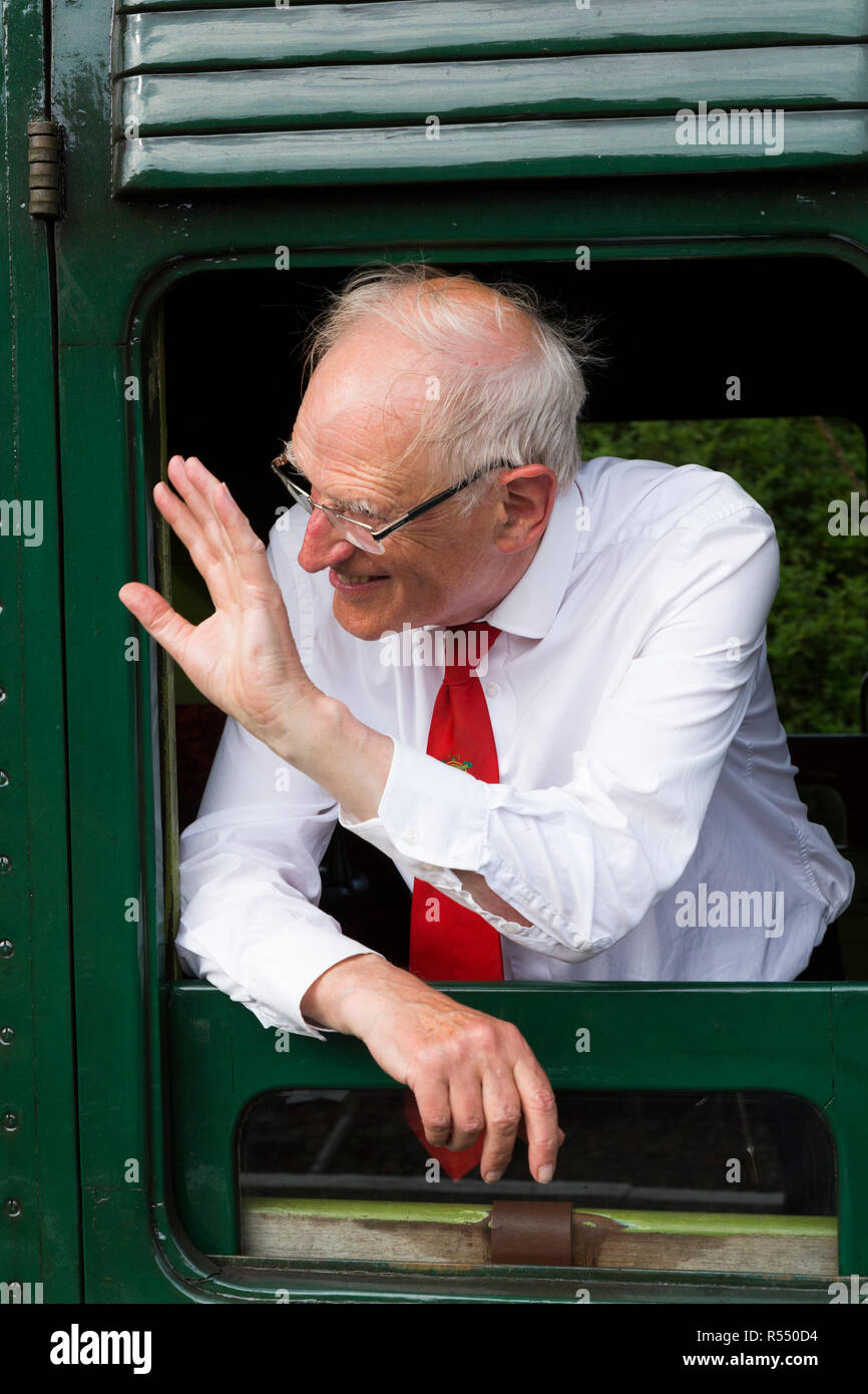 Man waving goodbye from steam train hi-res stock photography and images ...