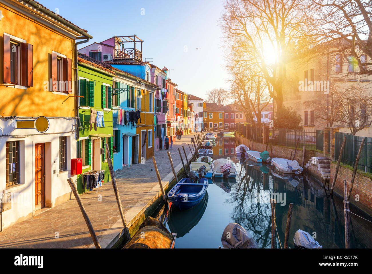 Street with colorful buildings in Burano island, Venice, Italy ...