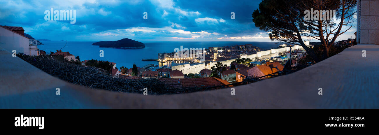 Panorama aerial night view of Dubrovnik, Lokrum Island and ocean with ...