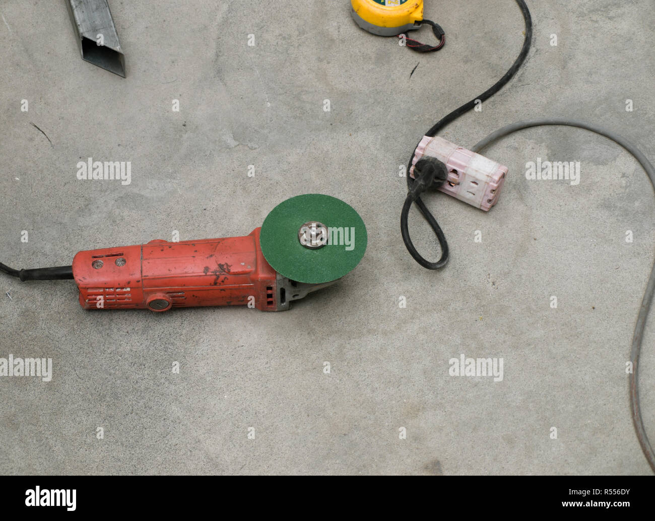 PLUGGED ELECTRIC GREEN WHEEL GRINDER Stock Photo - Alamy