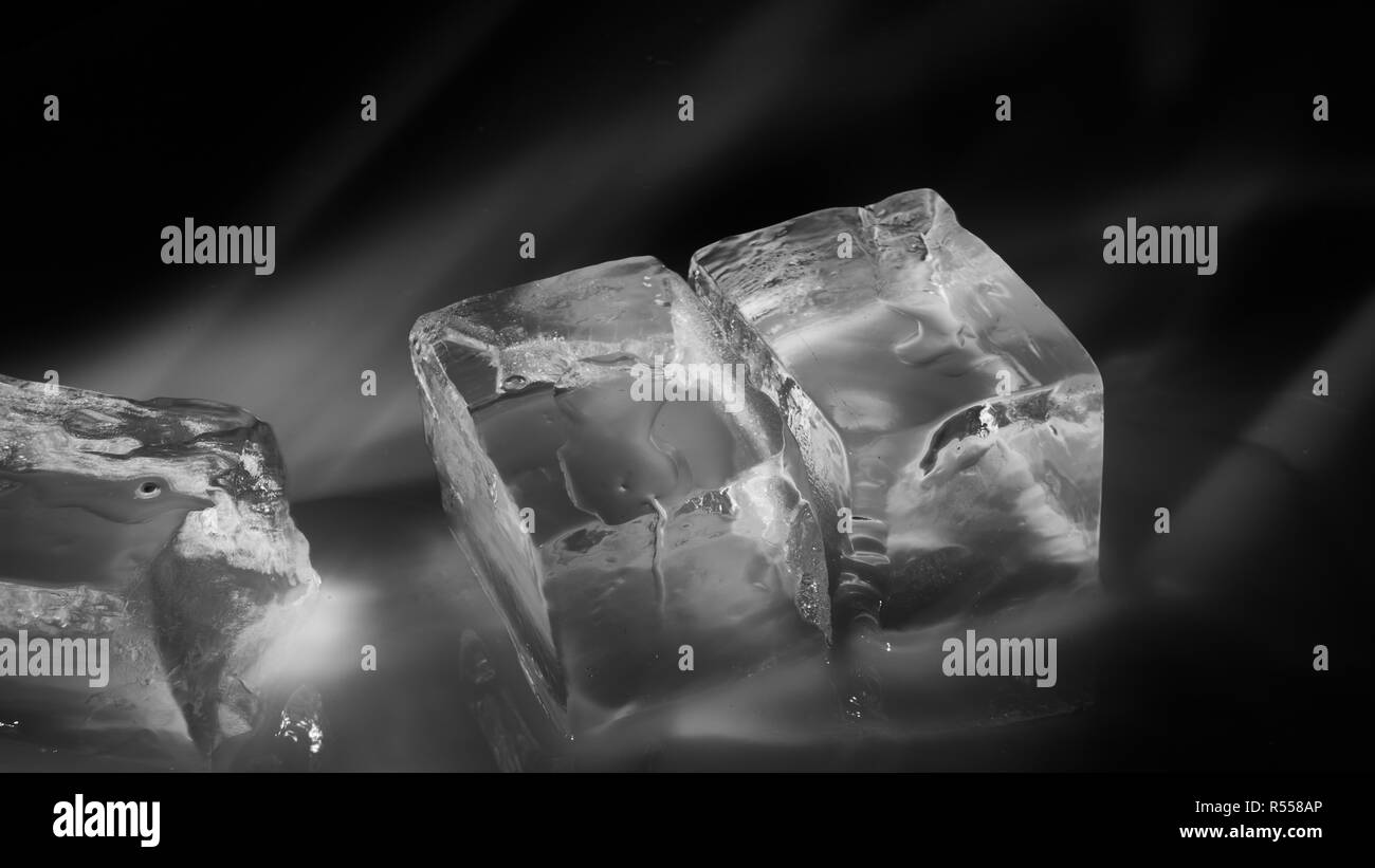 Pieces of crushed ice cubes on black background Stock Photo - Alamy