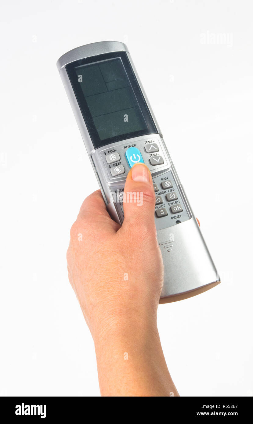 hand holding a remote control on white background Stock Photo - Alamy