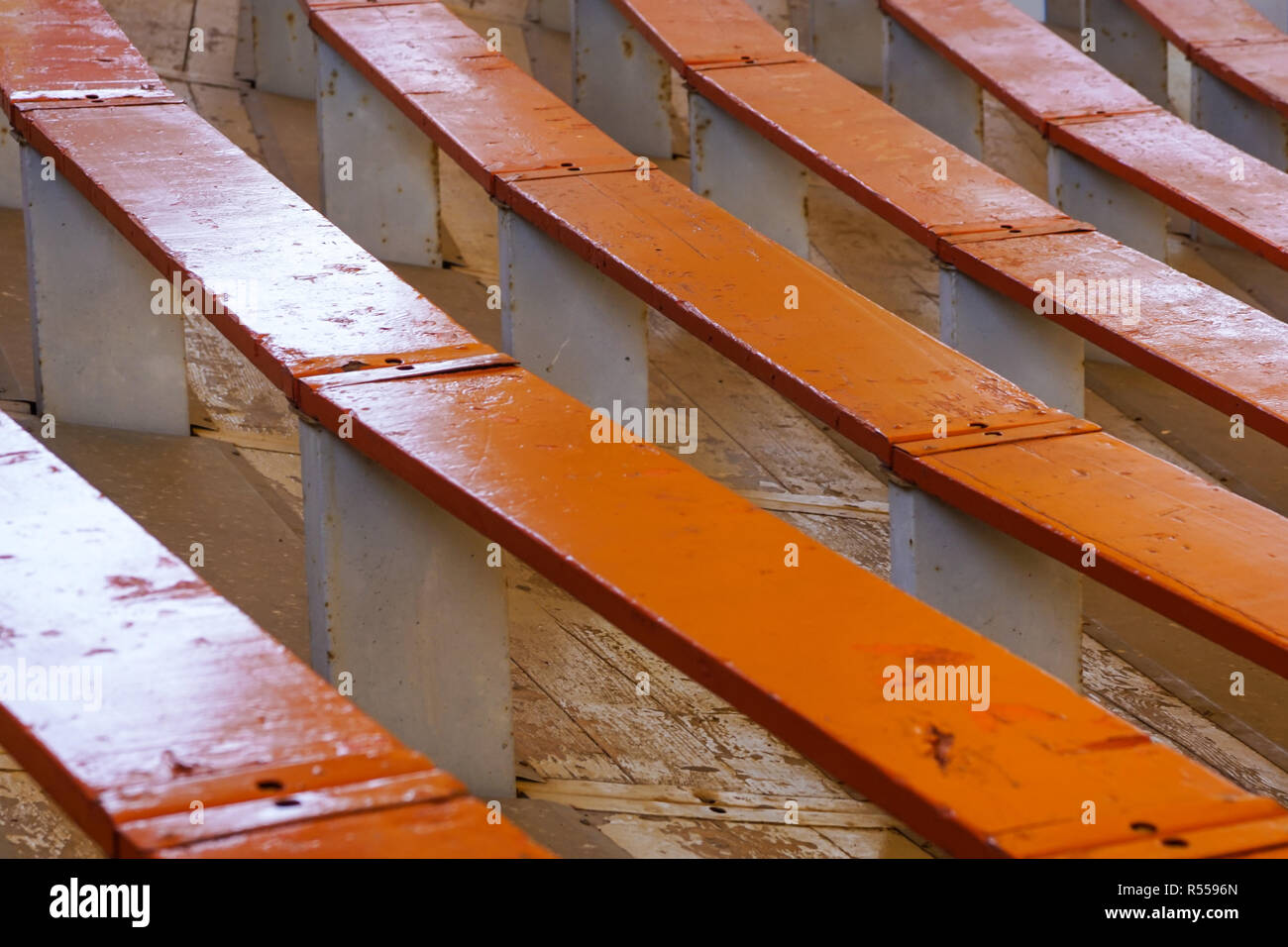 Rows of empty wooden stadium seats Stock Photo - Alamy