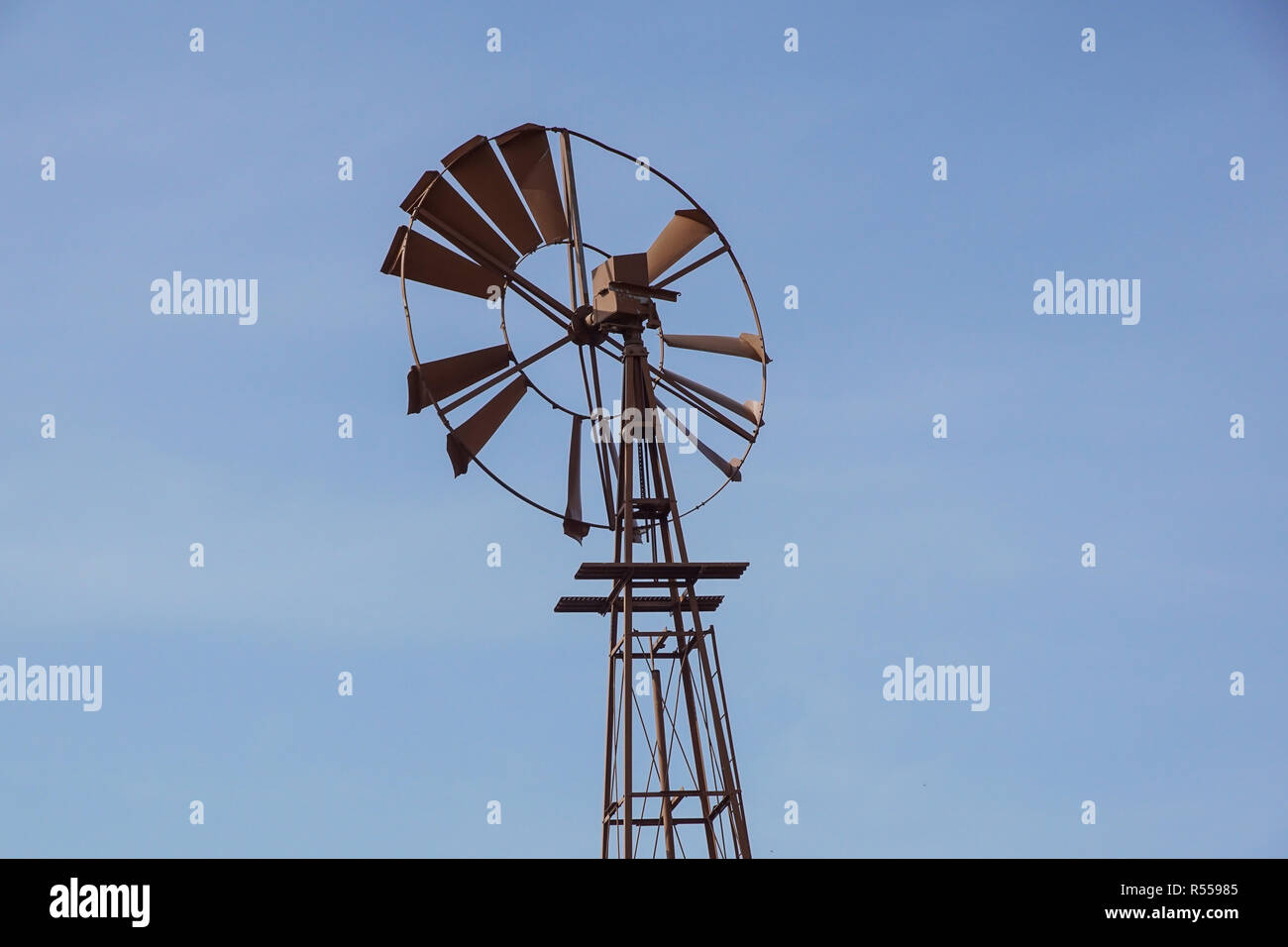 Vintage toned photo of an old western windmill tower, American wild ...