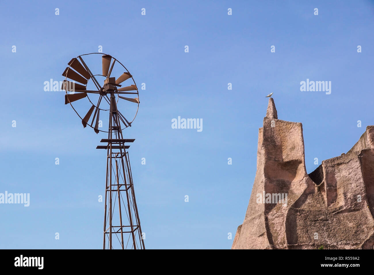 Vintage toned photo of an old western windmill tower, American wild ...
