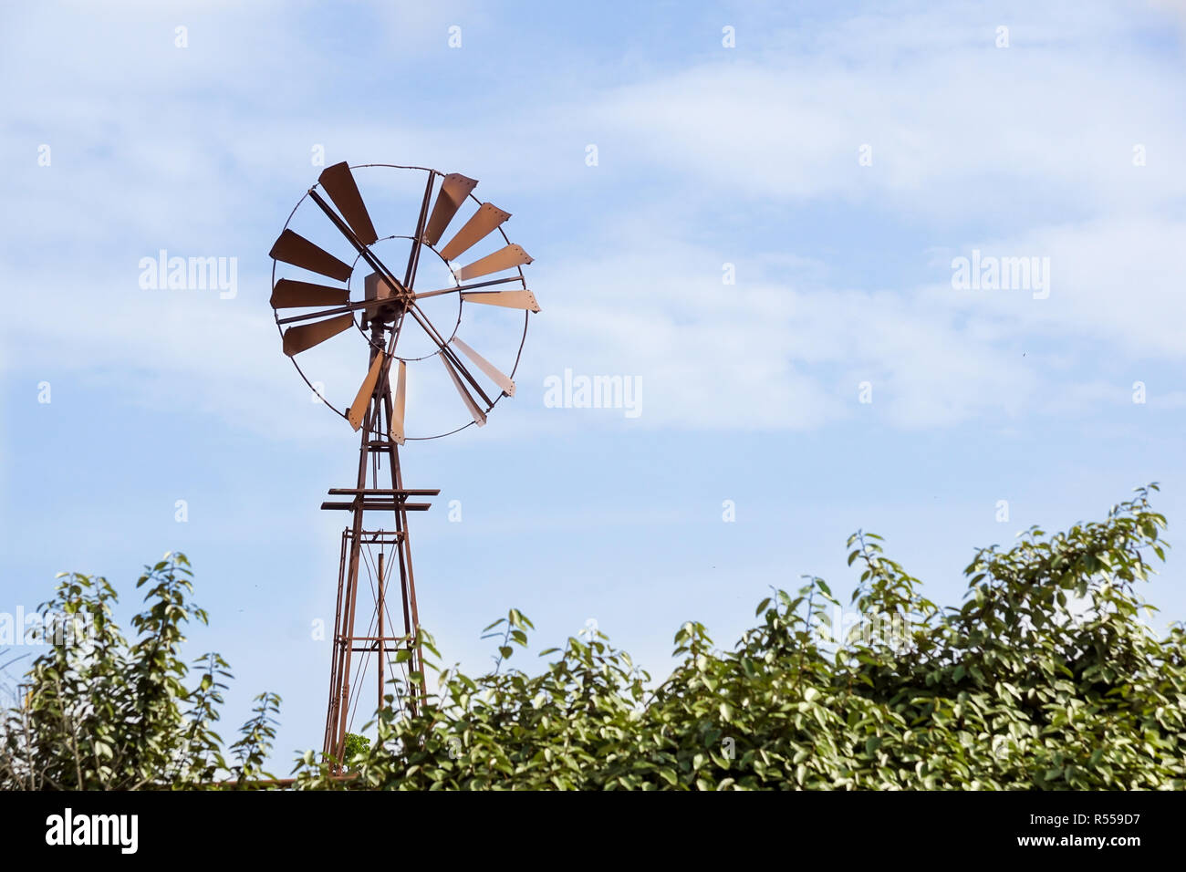 Vintage toned photo of an old western windmill tower, American wild ...