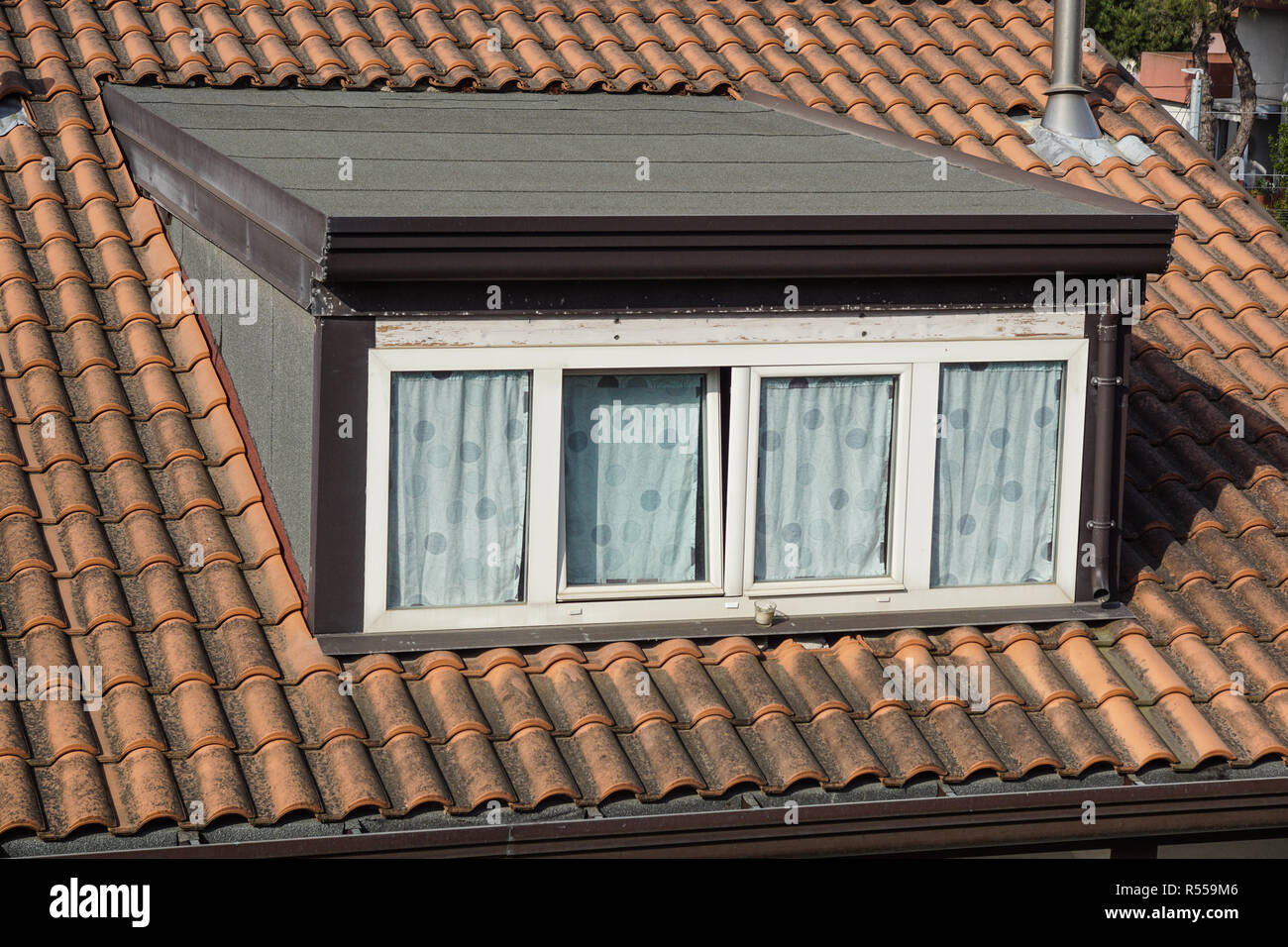 Roof window with roller shutter Stock Photo - Alamy