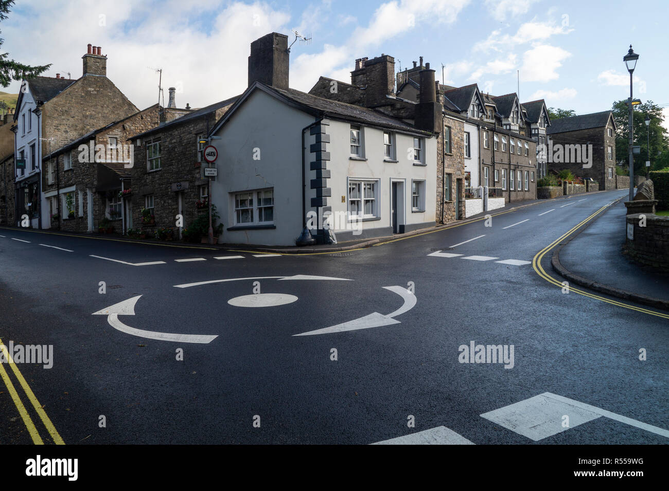 Newly resurface road with painted arrows for mini roundabout Stock ...