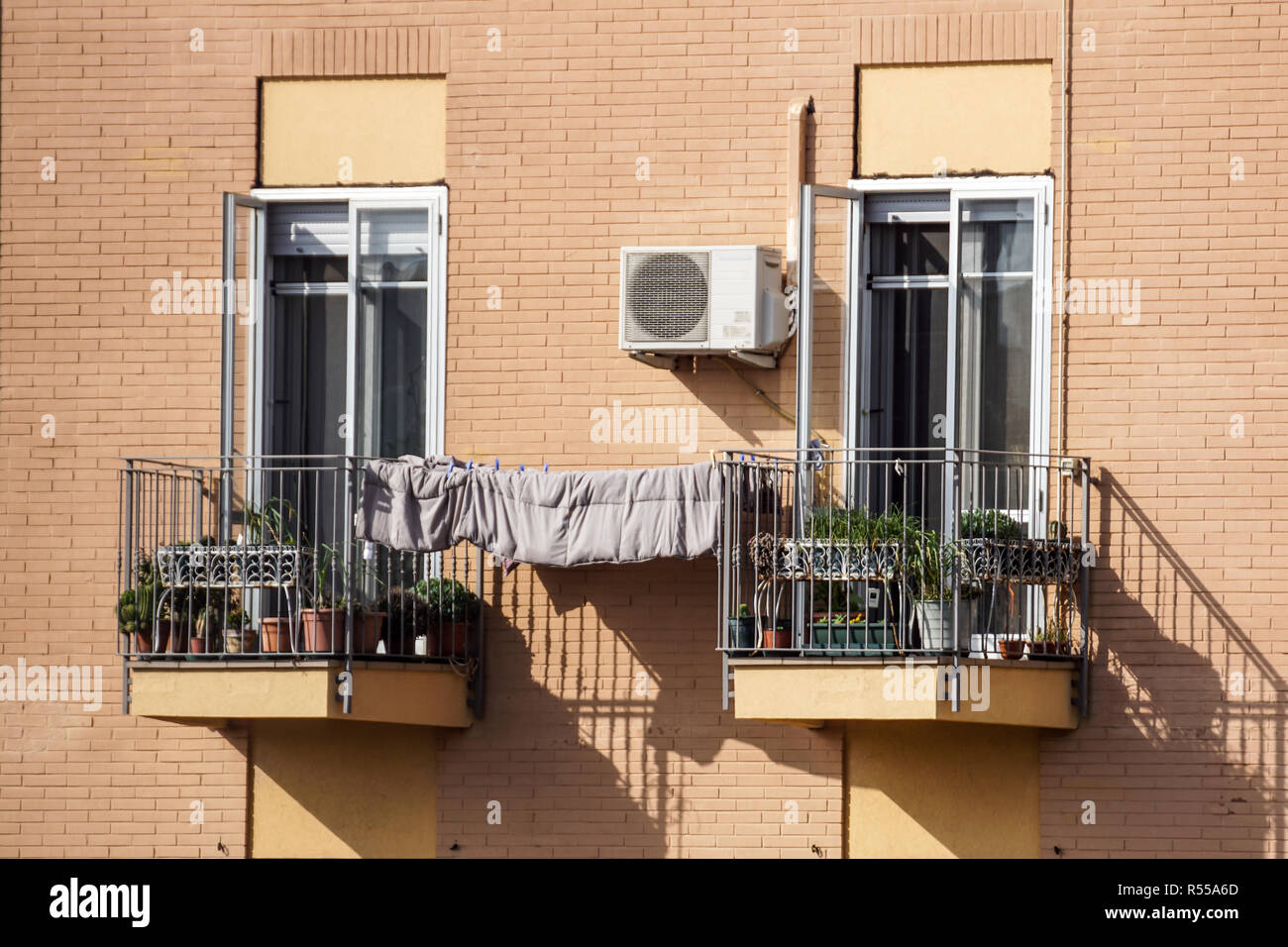 old apartment buildings on a sunny day with a blue sky. Facade of a ...