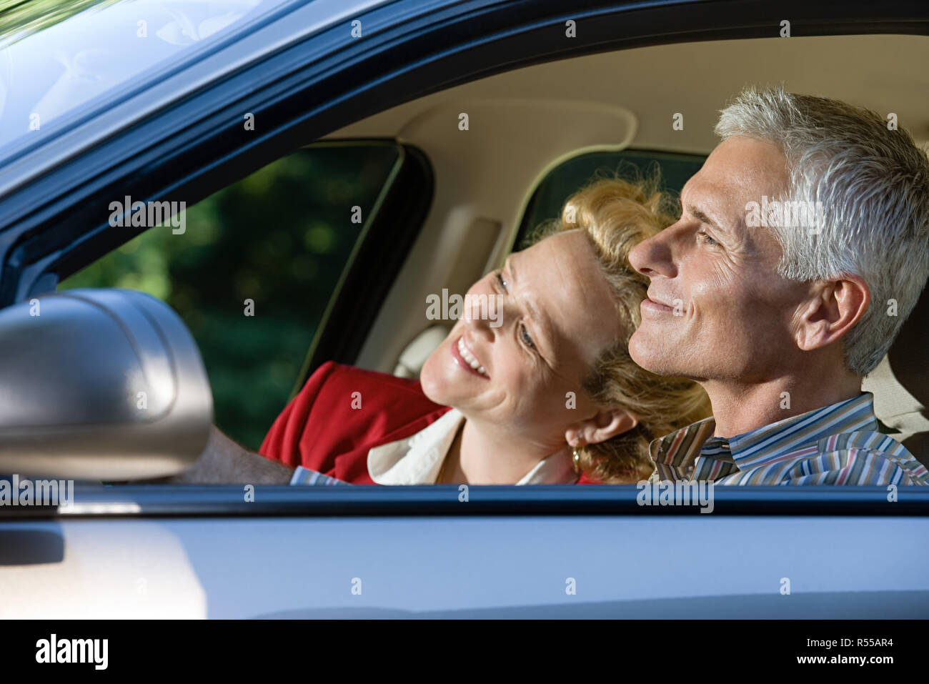 Mature couple in a car Stock Photo - Alamy