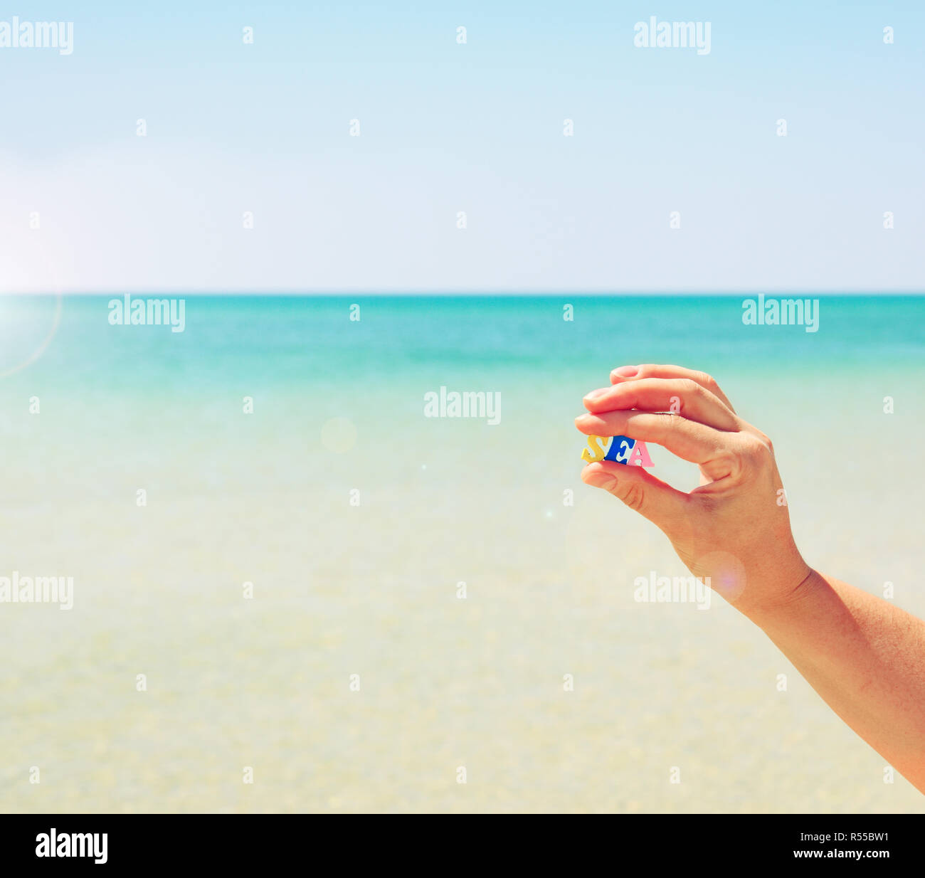 Human hand holds letters Stock Photo - Alamy