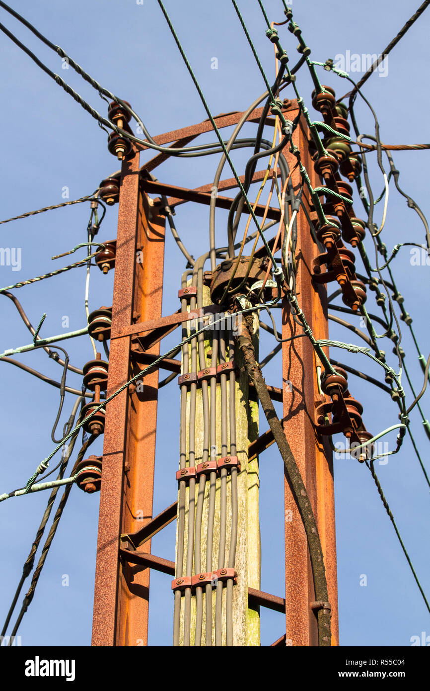 An old rusty electricity pylon in the village of Broad Oak in East ...