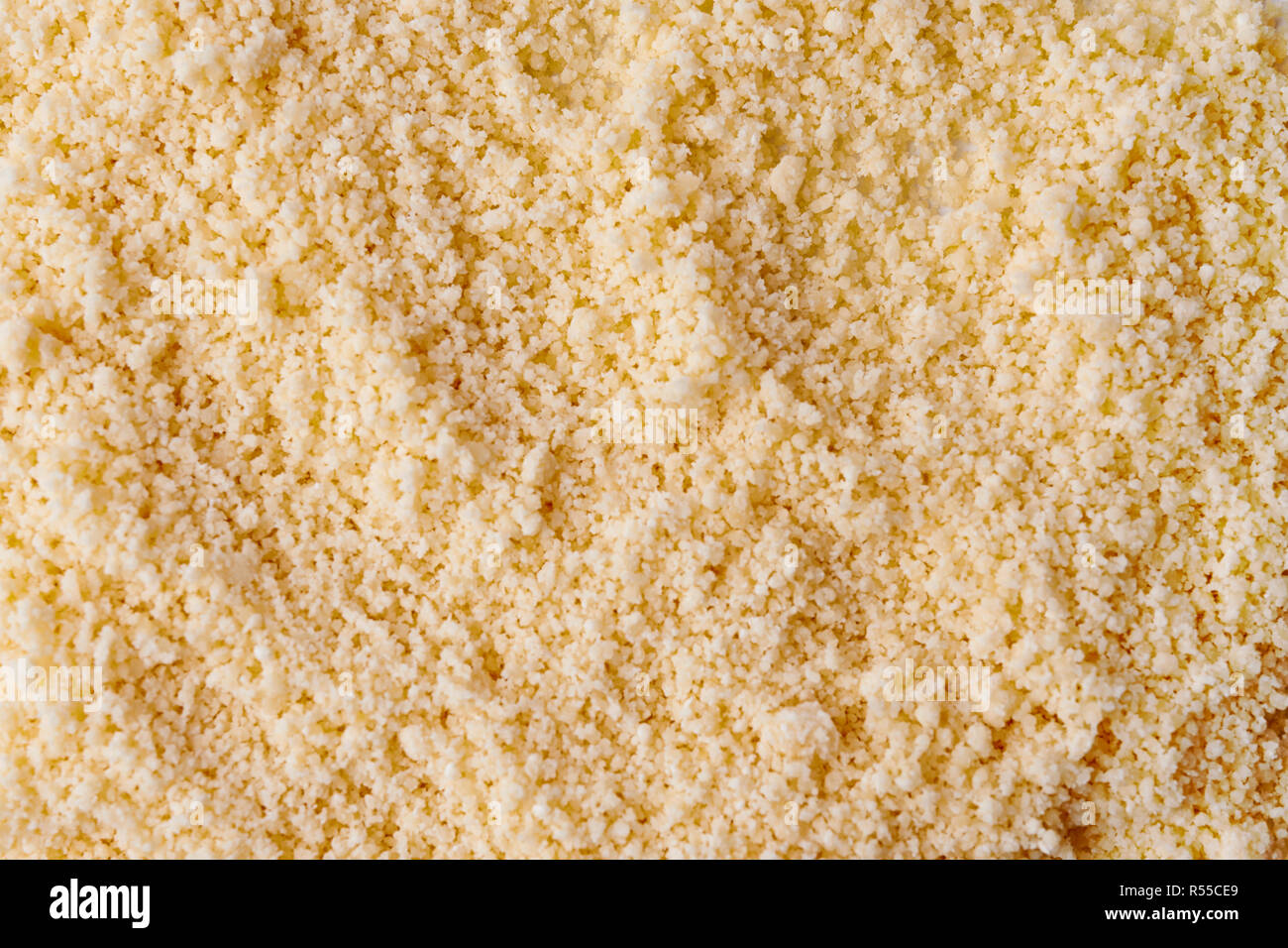 dried ground cheese as background Stock Photo - Alamy