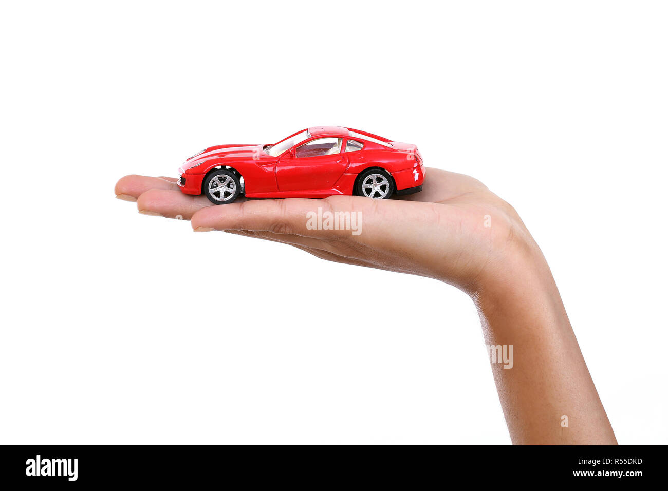 Red toy car woman's hand Stock Photo - Alamy