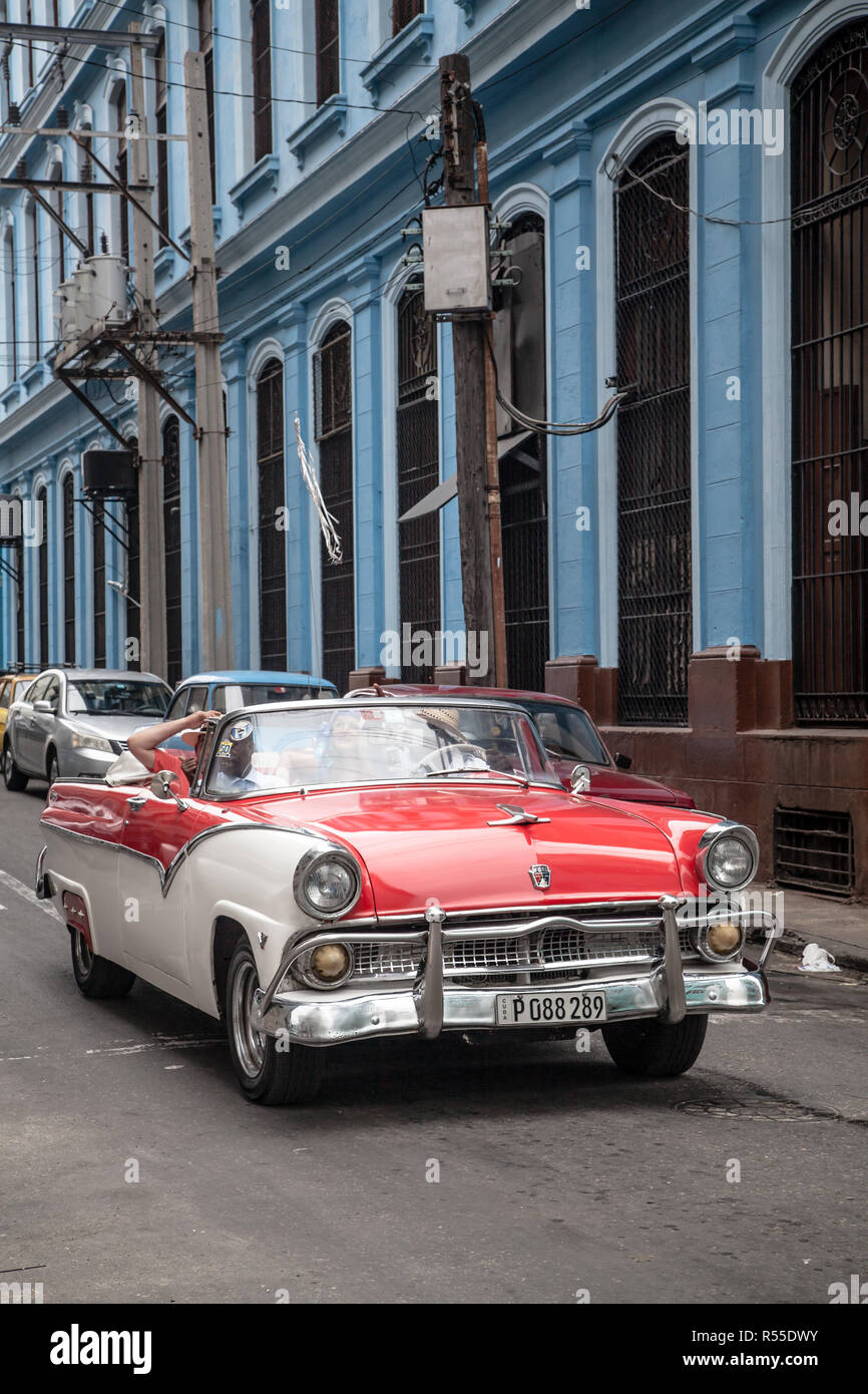 Classic Cadillac driving on the streets of Cuba Stock Photo - Alamy