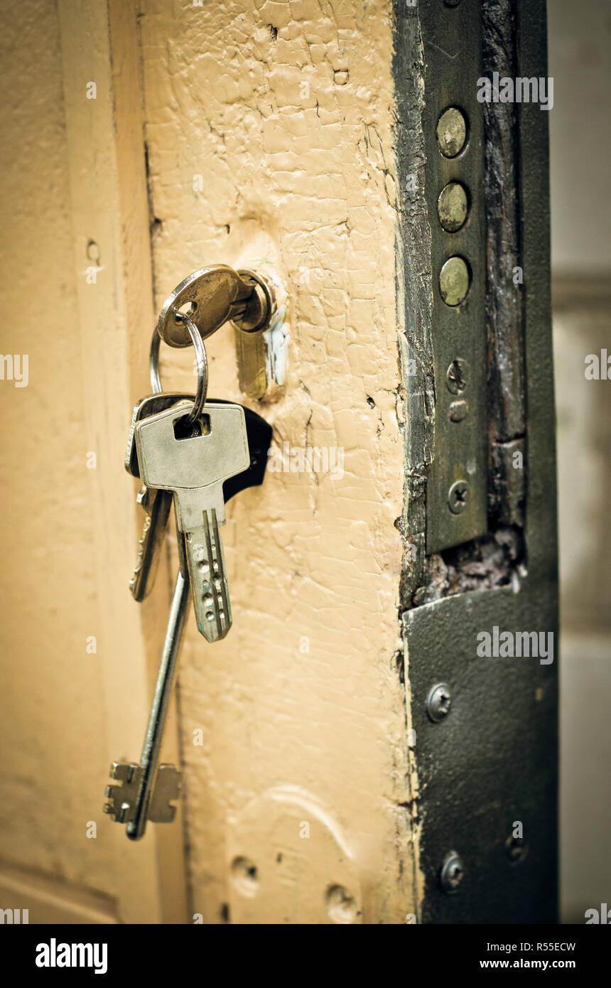 old key in keyhole with lock Stock Photo - Alamy