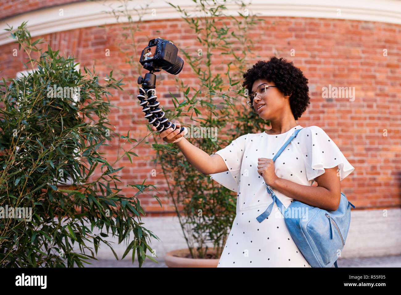 Beautiful young woman filming hi-res stock photography and images - Alamy