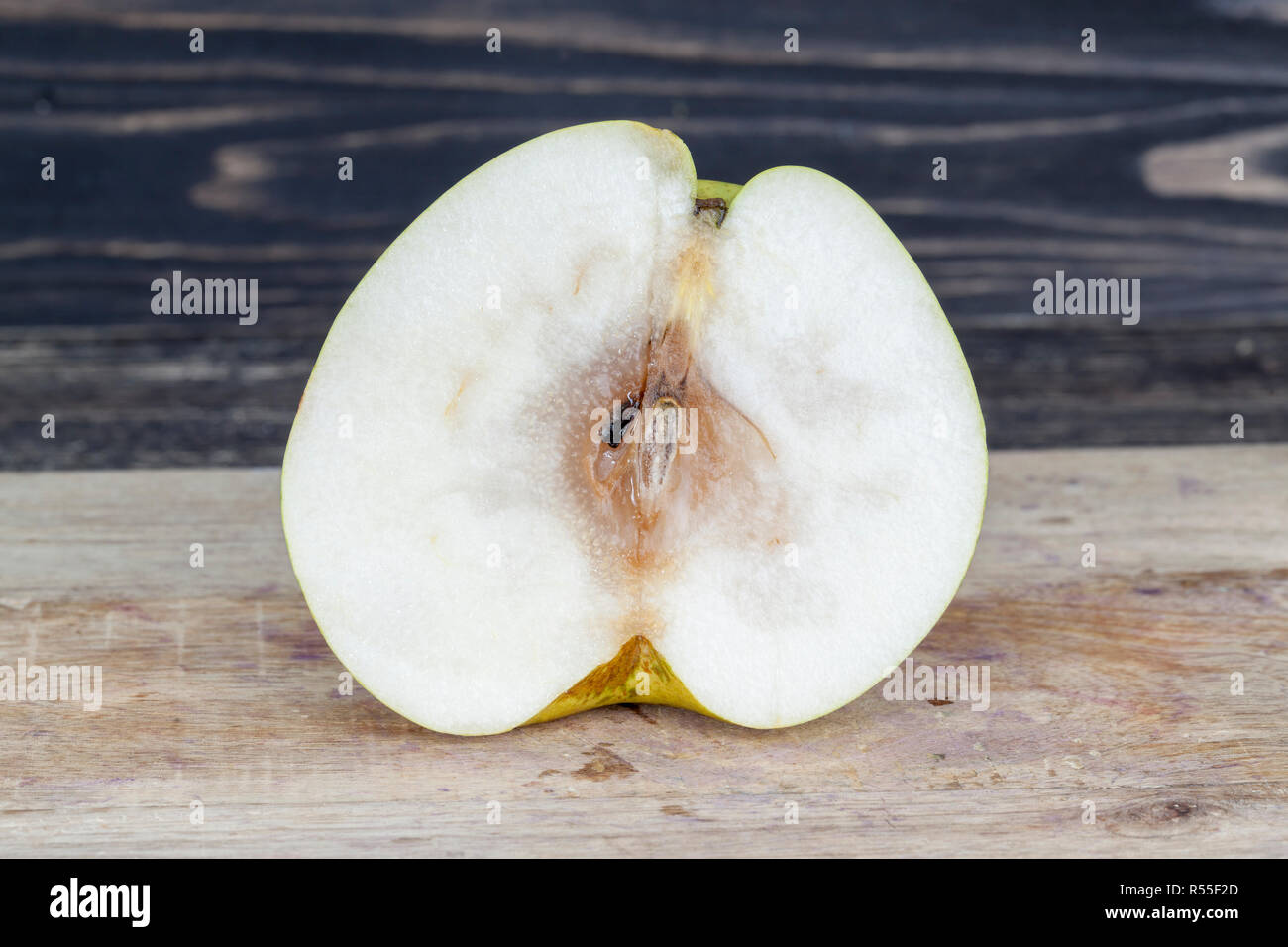 cut large ripe pear, which began to rot from the inside Stock Photo - Alamy