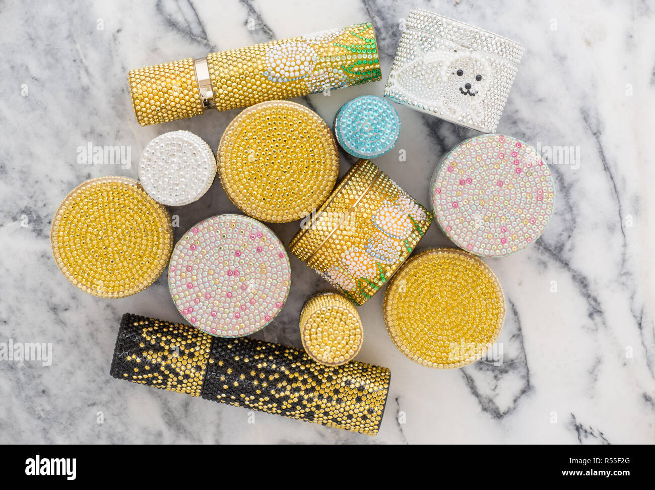 Set of different shape and color body cream containts on a marble ...