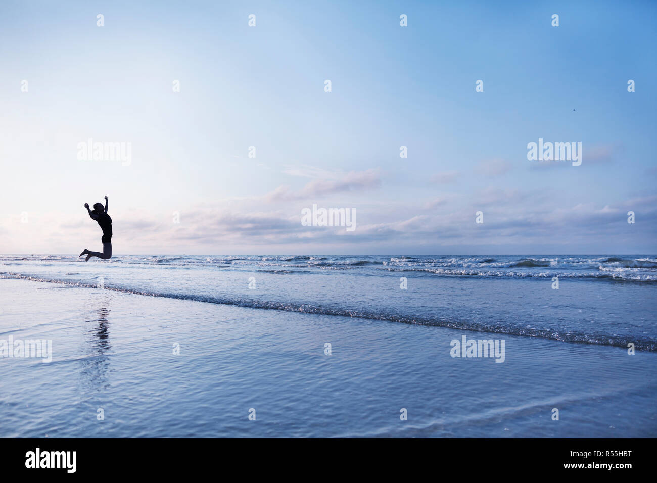 Silhouette woman skipping on beach hi-res stock photography and images ...