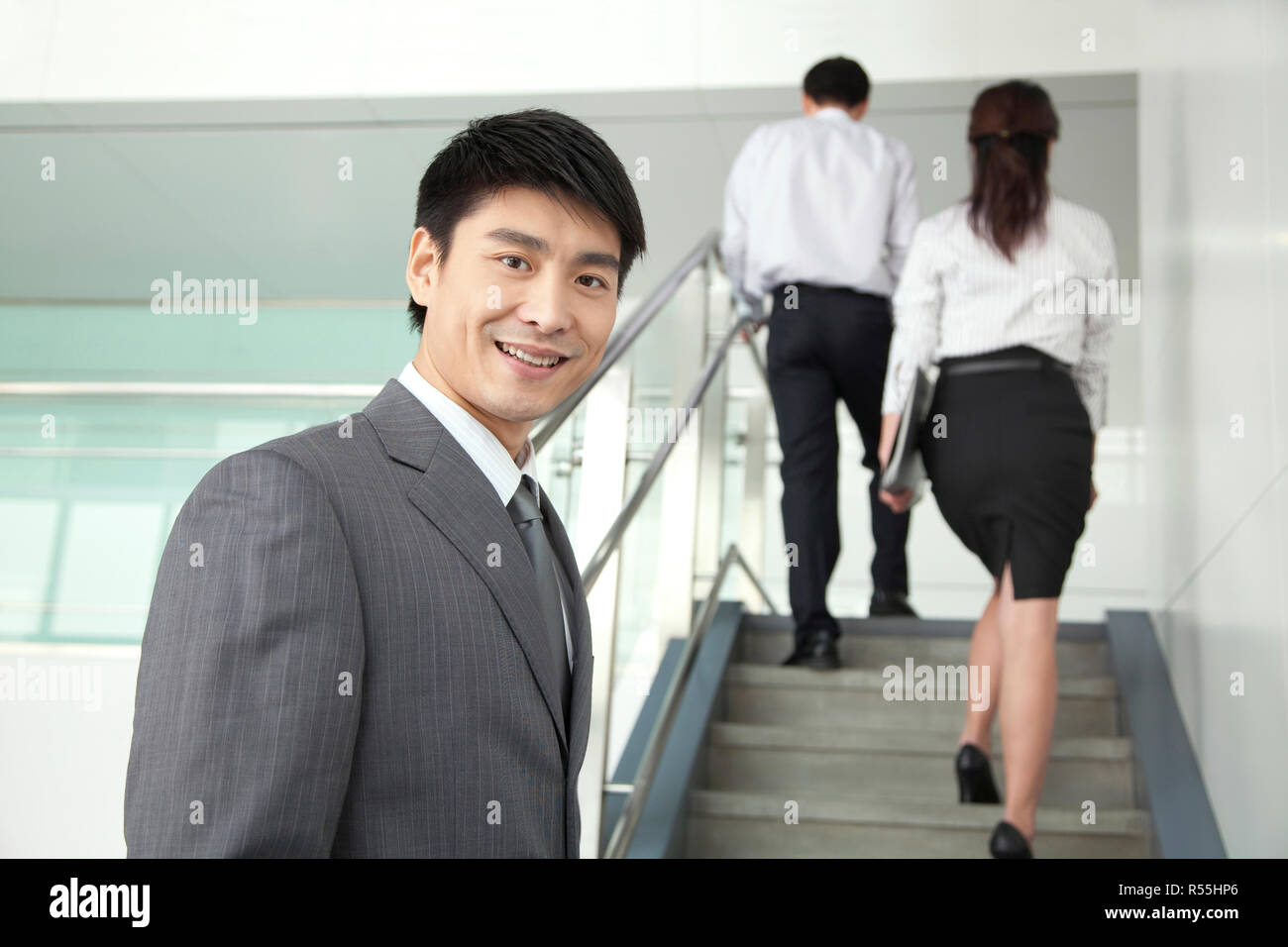 Man and woman going up steps hi-res stock photography and images - Alamy