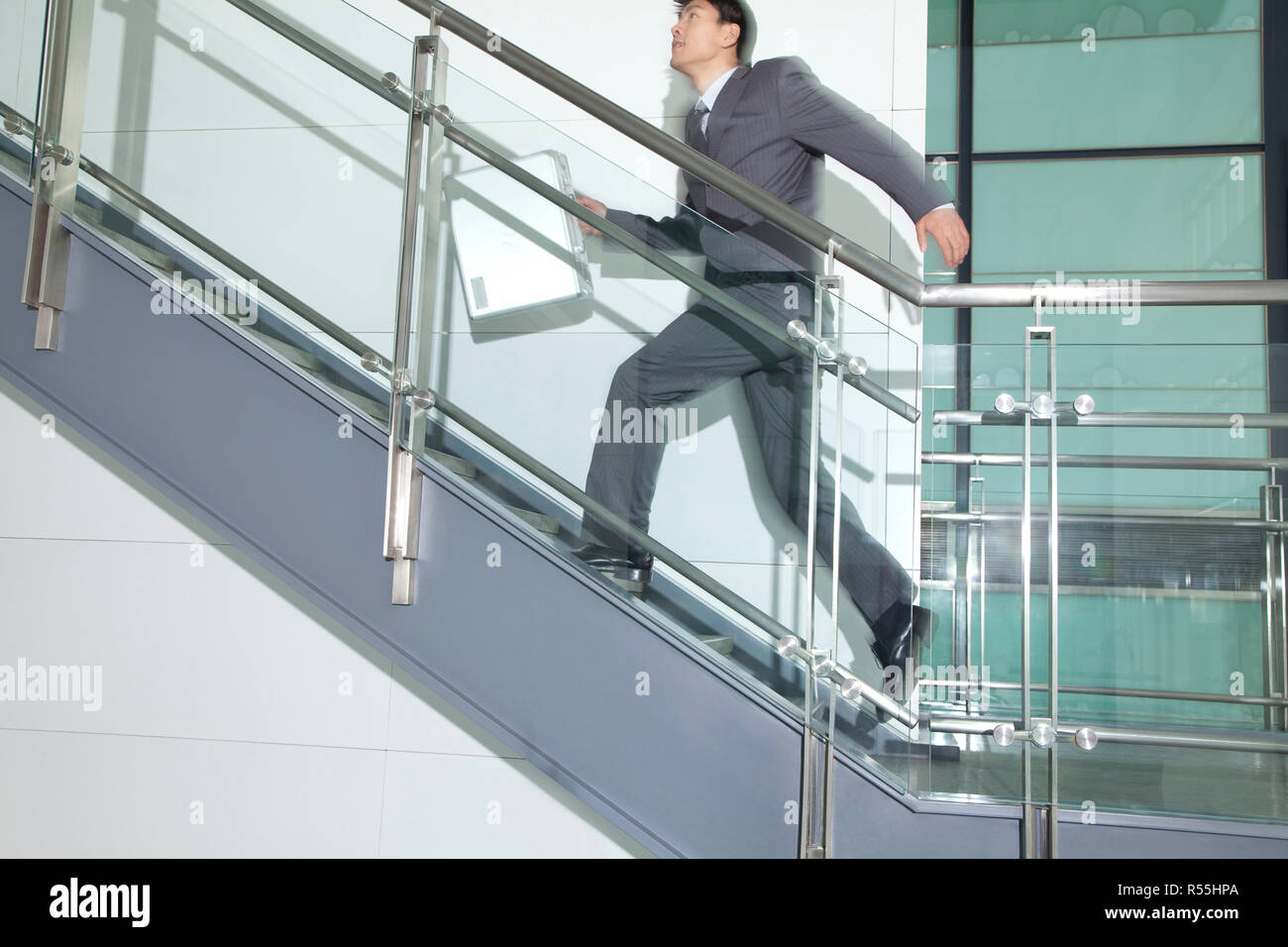 Business Man Running Up Stairs Stock Photo - Alamy