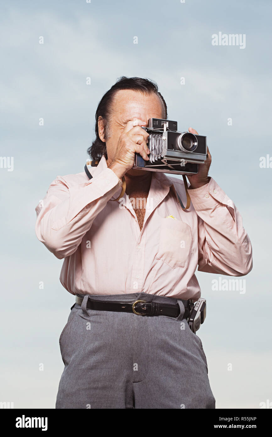 Man taking a photograph Stock Photo - Alamy