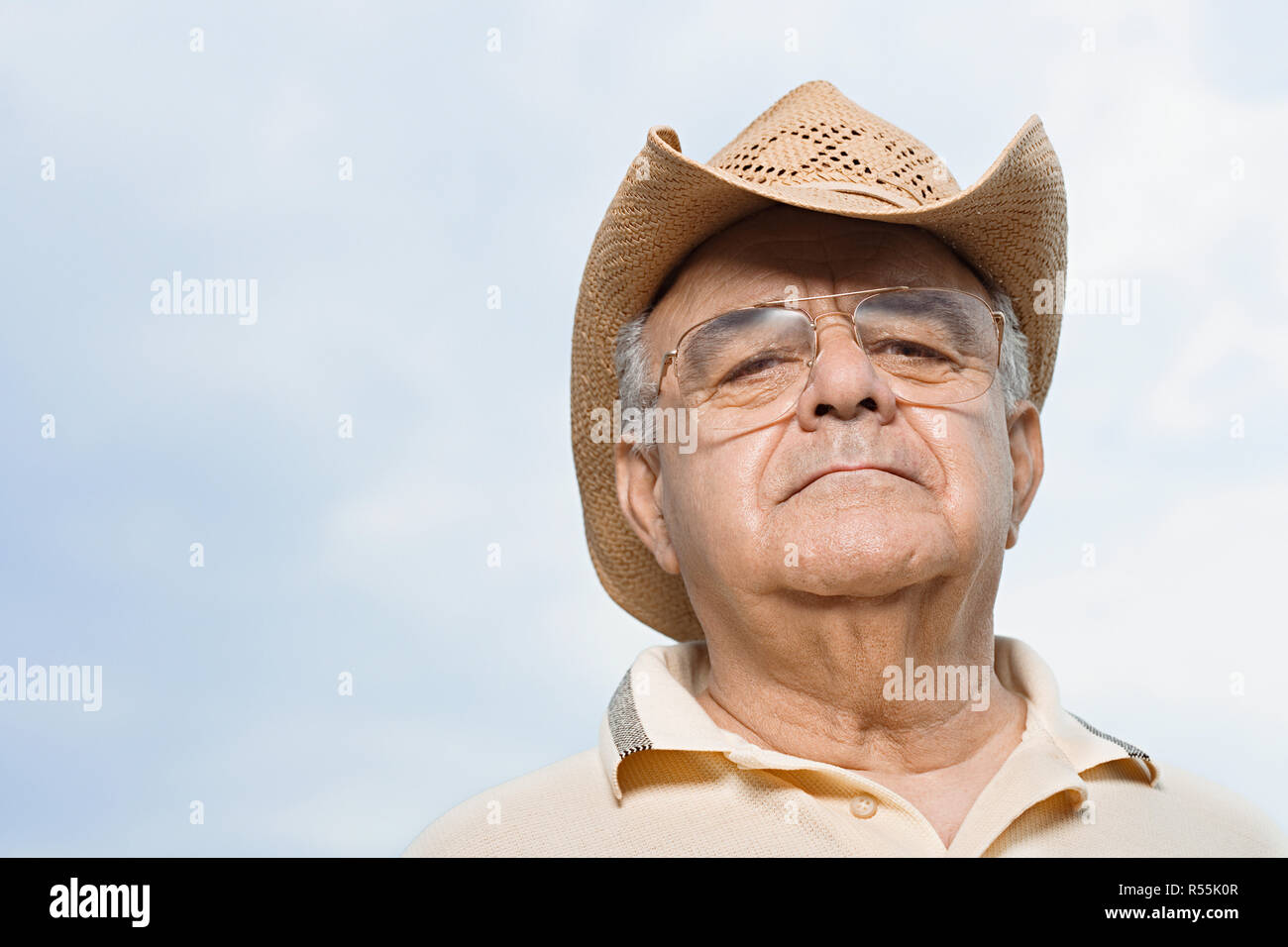 Thoughtful older man wearing glasses hi-res stock photography and ...