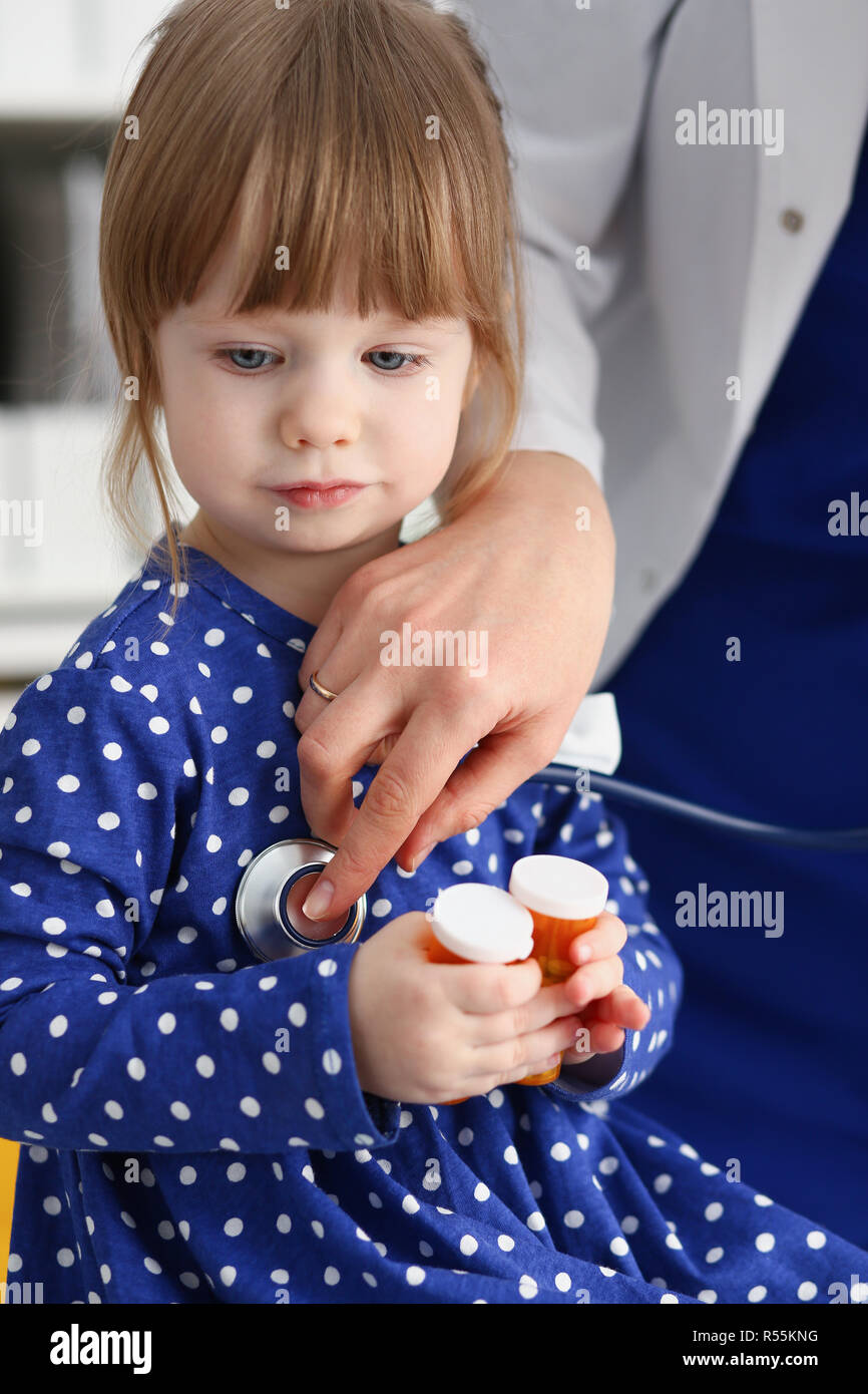 Little child with stethoscope at doctor reception Stock Photo - Alamy