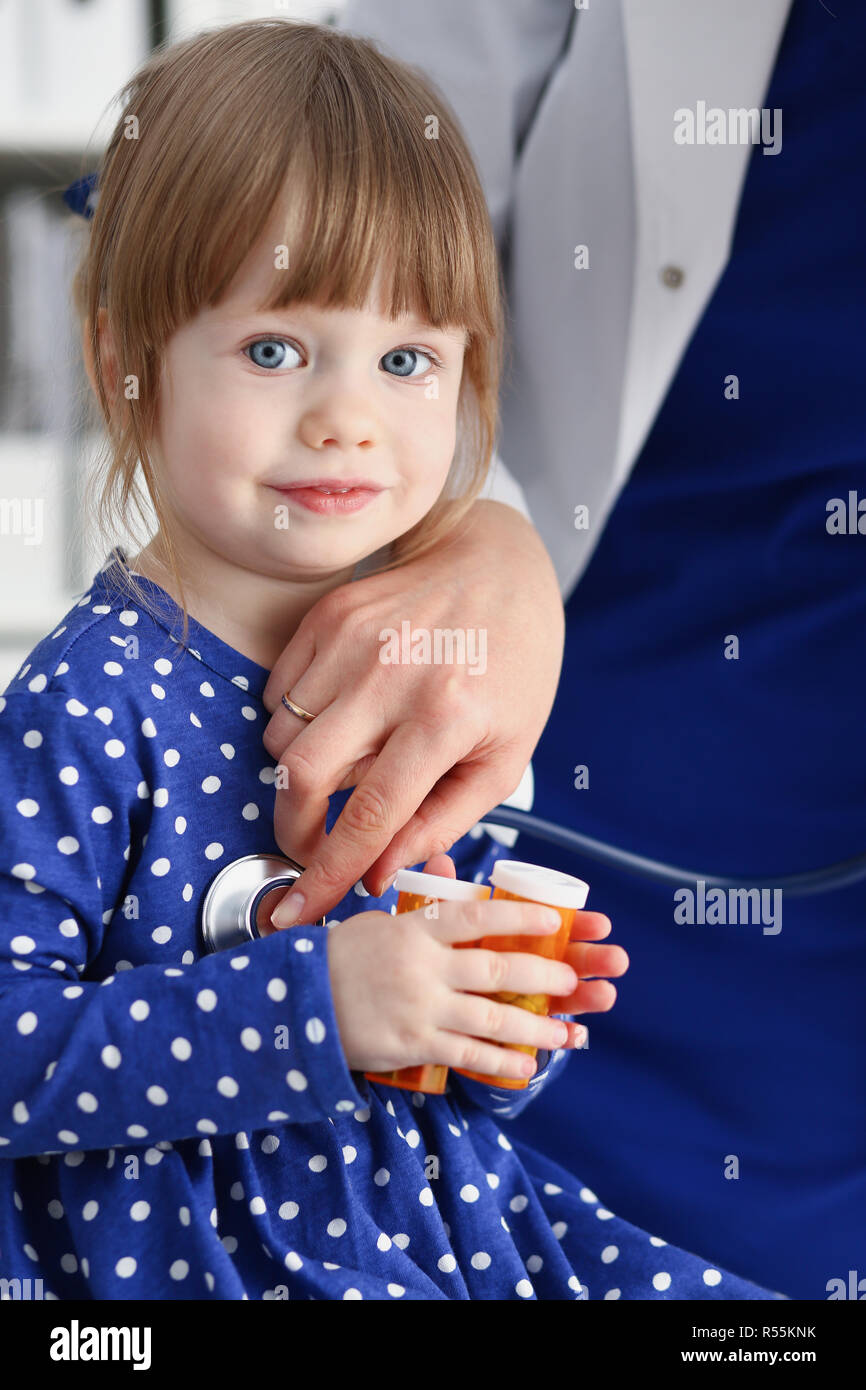 Little child with stethoscope at doctor reception Stock Photo - Alamy