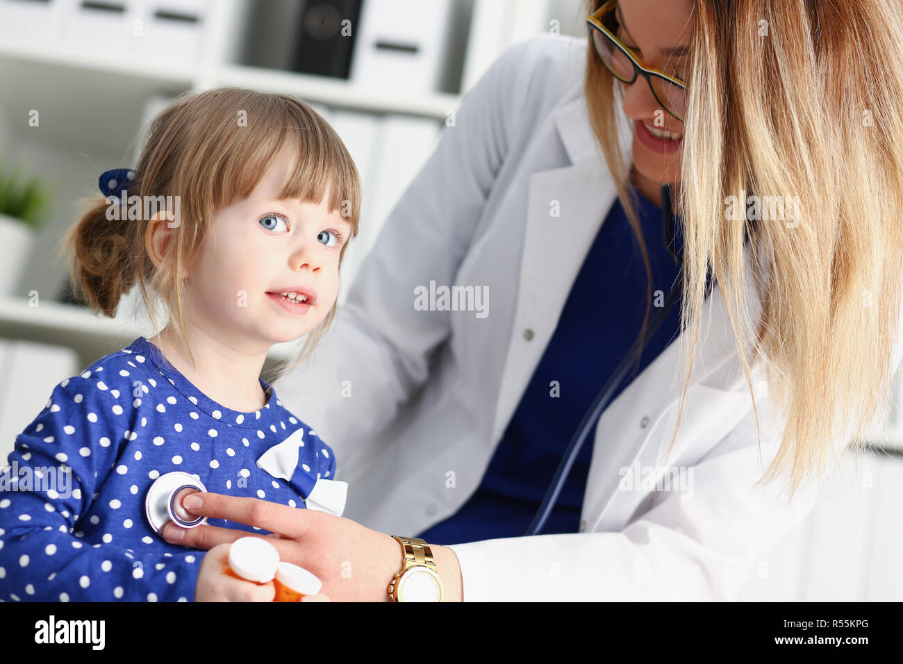 Little child with stethoscope at doctor reception Stock Photo - Alamy