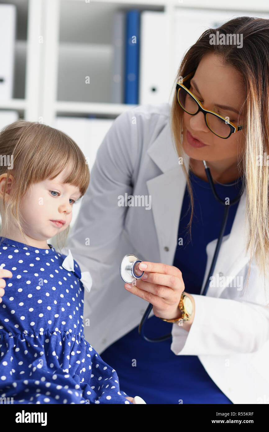 Little child with stethoscope at doctor reception Stock Photo - Alamy
