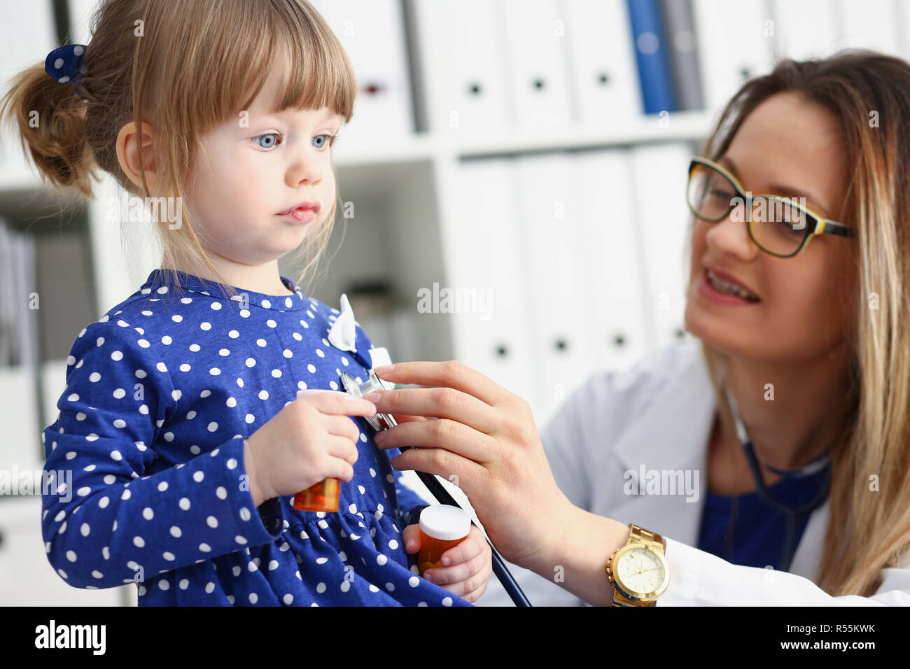 Little child with stethoscope at doctor reception Stock Photo - Alamy
