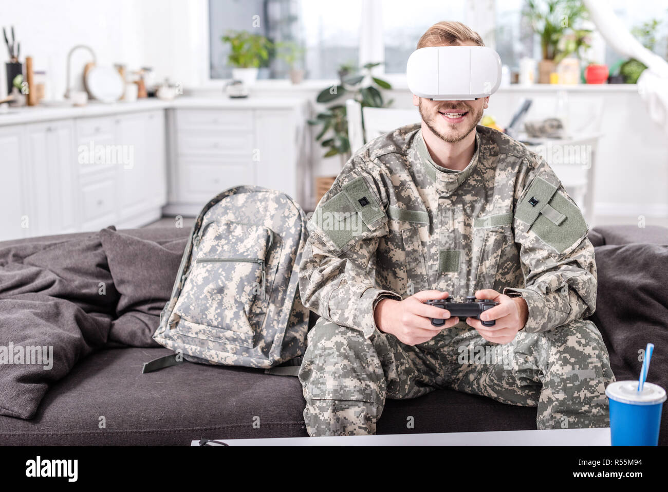 Man vr on couch controller hi-res stock photography and images - Alamy