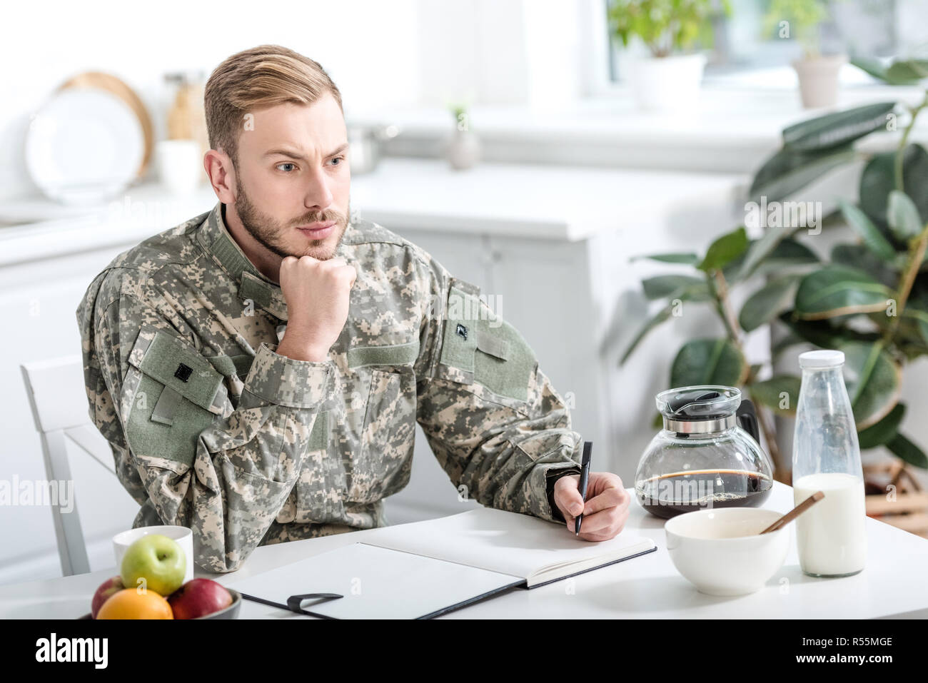 Army soldier sitting kitchen table hi-res stock photography and images ...