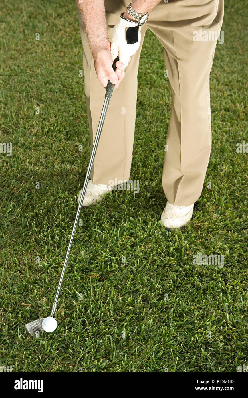 Senior man playing golf Stock Photo - Alamy