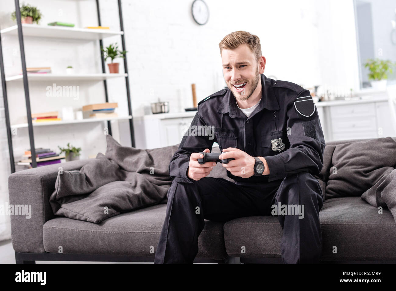 Laughing police man hi-res stock photography and images - Alamy