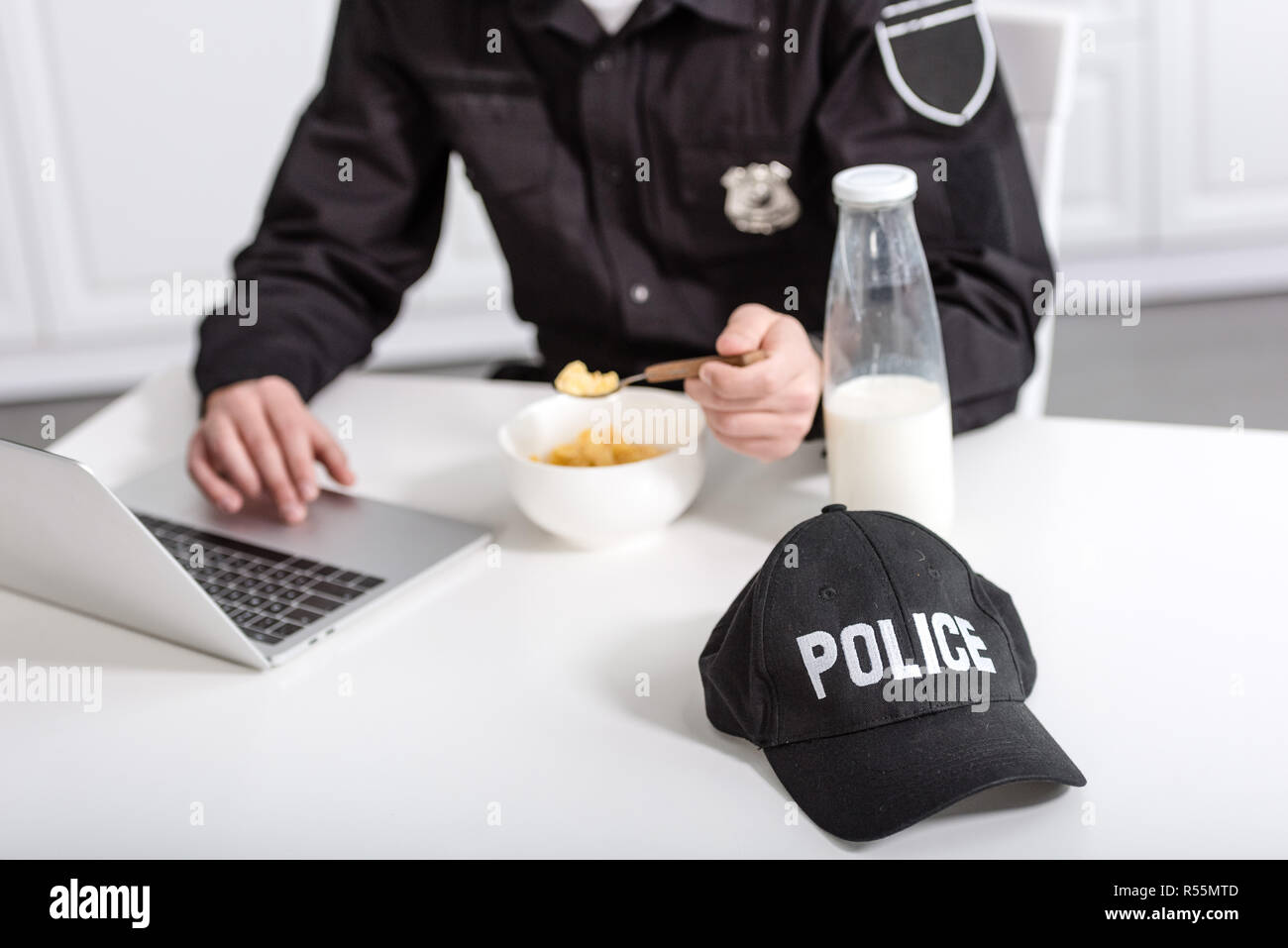 Police officer typing on computer hi-res stock photography and images ...