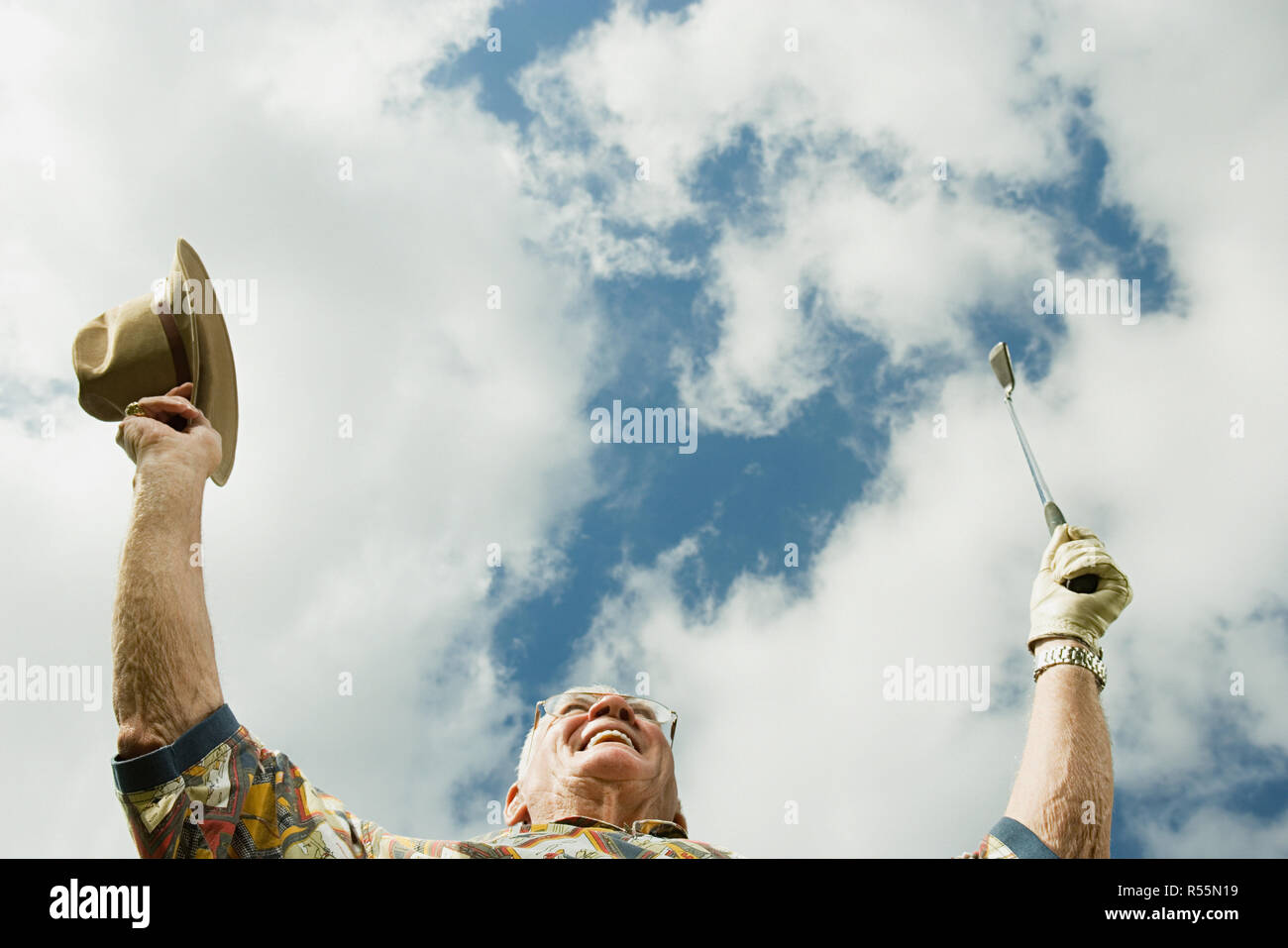 Senior man playing golf Stock Photo - Alamy