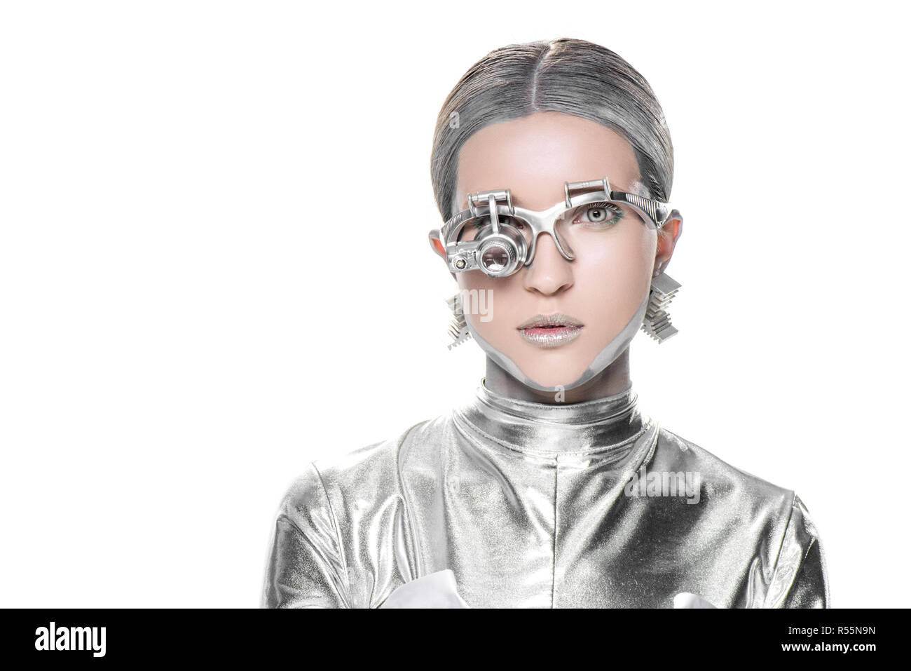 portrait of silver robot with eye prosthesis looking at camera isolated ...